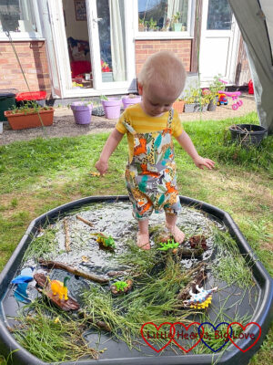 Sensory play in a tuff tray dinosaur swamp - Little Hearts, Big Love