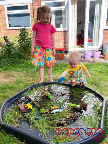 Sensory play in a tuff tray dinosaur swamp - Little Hearts, Big Love