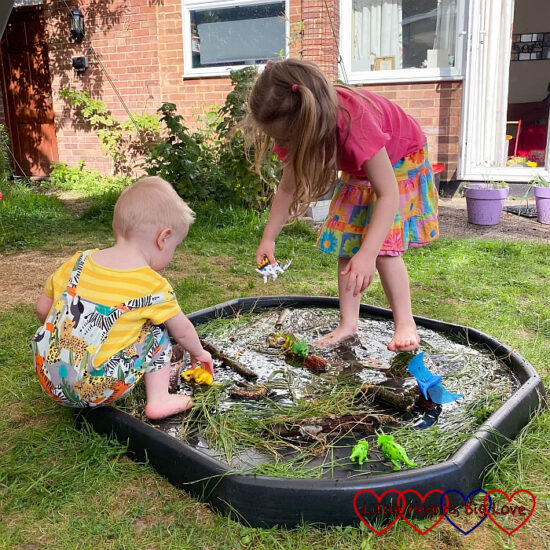 Sensory play in a tuff tray dinosaur swamp - Little Hearts, Big Love